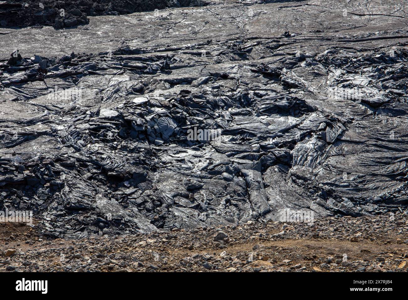 Molten black basalt lava at Fagradalsfjall volcano lava field created ...