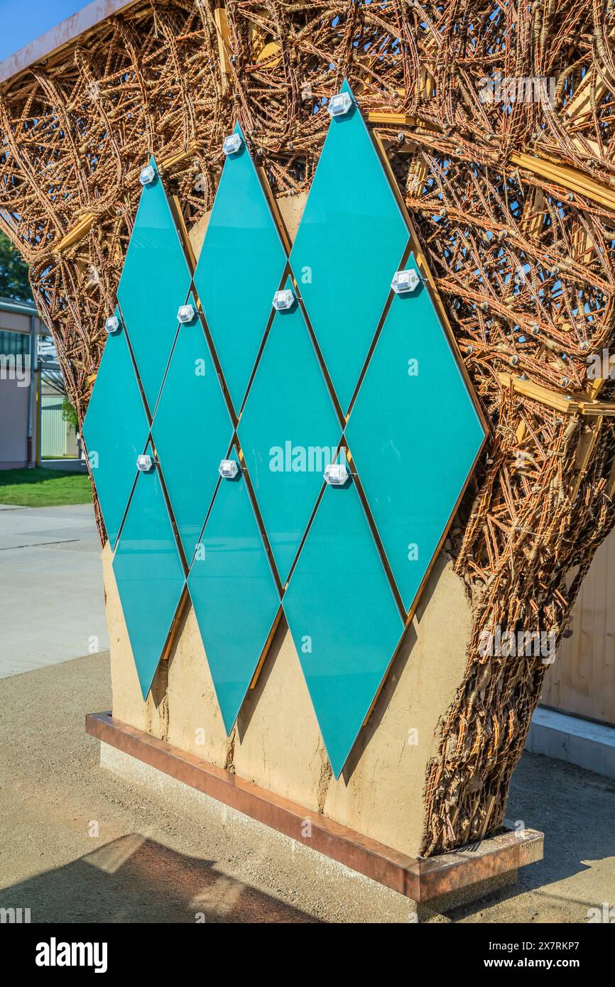 Small solar panels for solar energy installed on a wall of public park ...