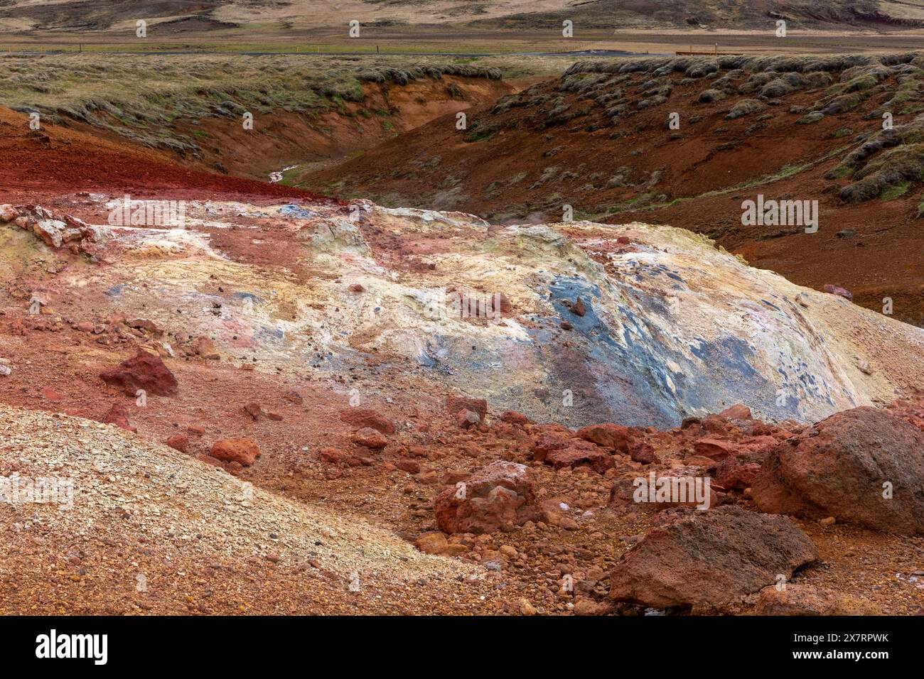 Red, orange and blue sulphur soil and stones in Seltun Geothermal Area ...