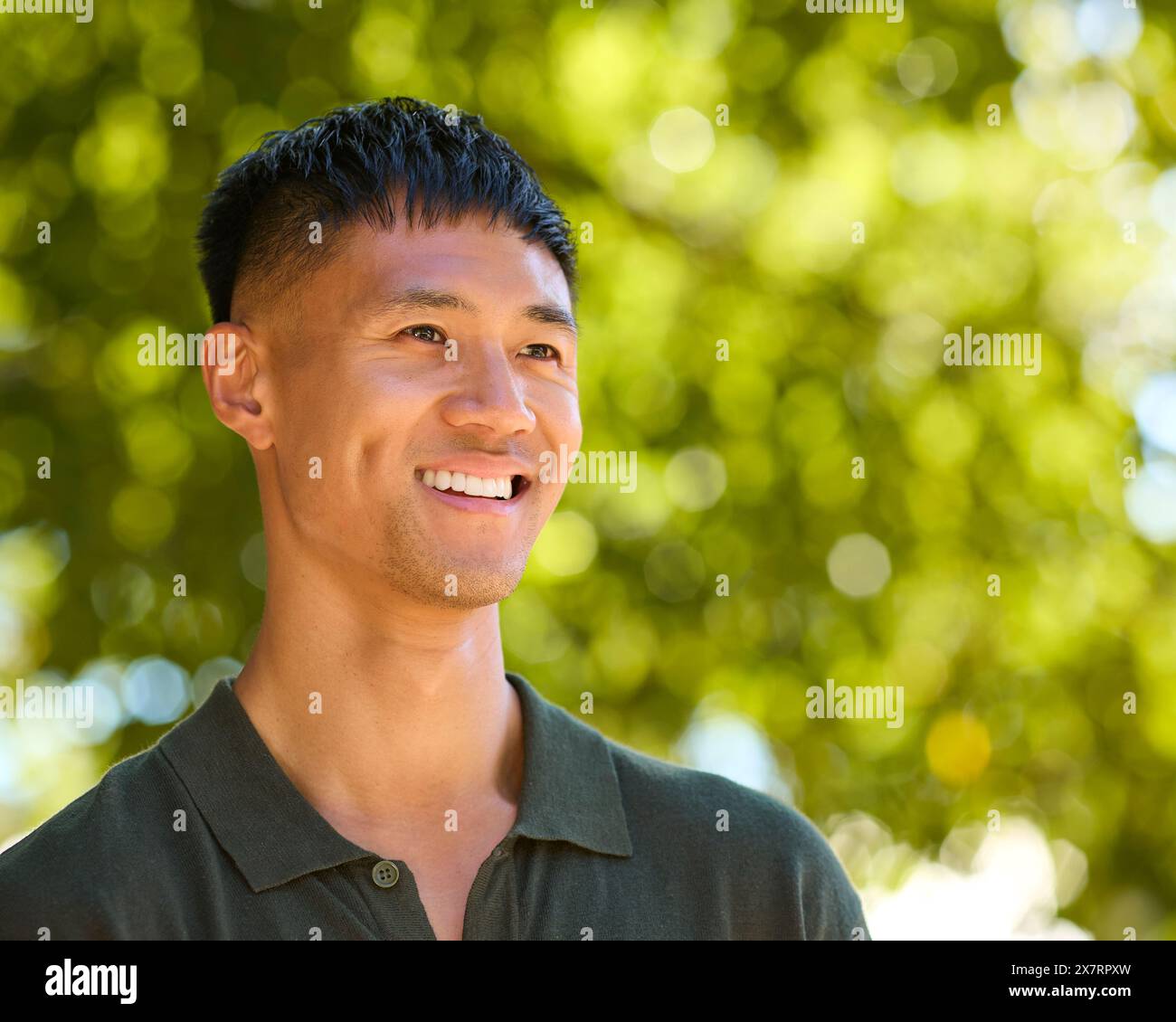 Head And Shoulders Portrait Of Smiling Man Outside Relaxing In ...