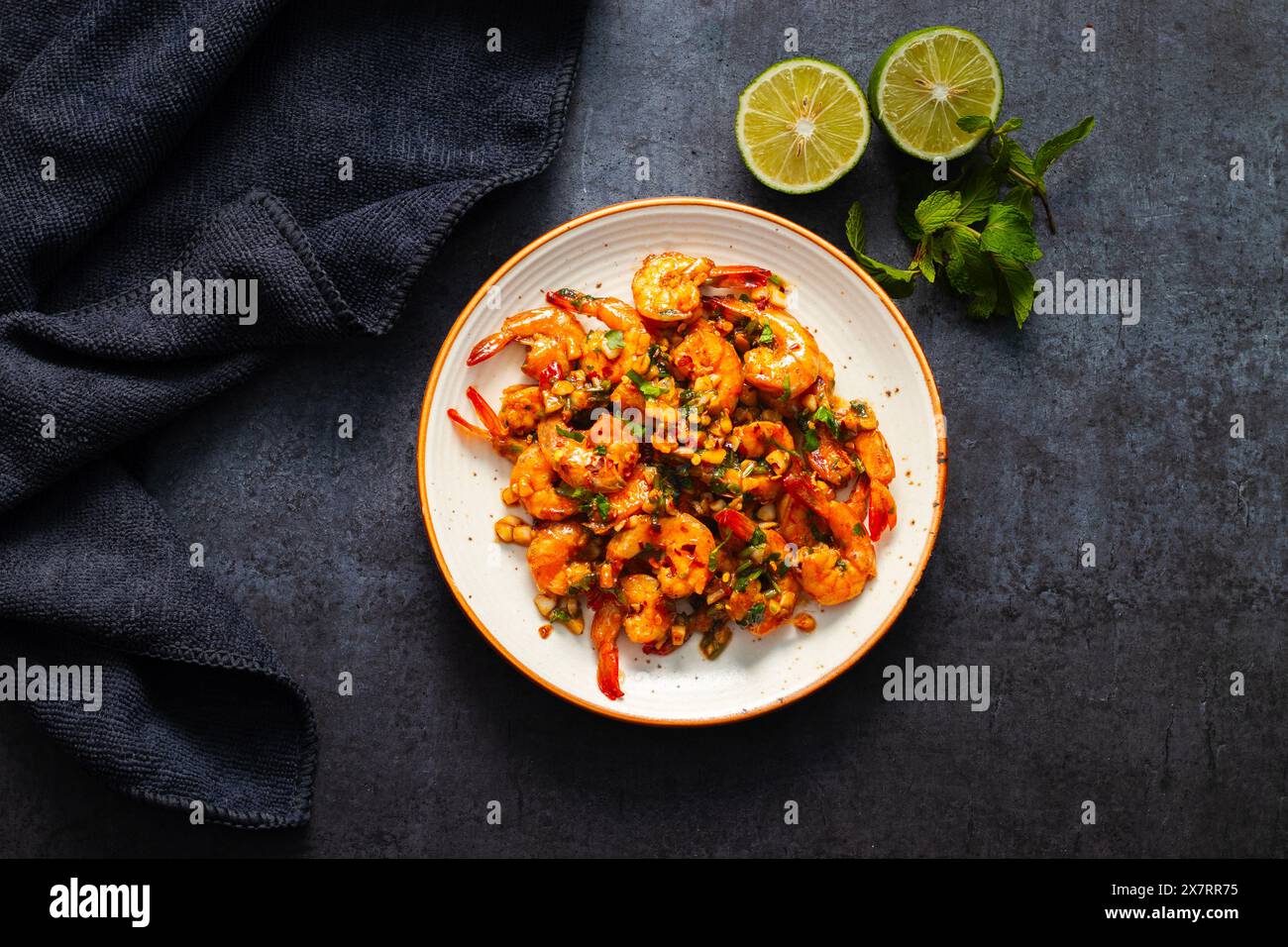 selective focus of Butter Garlic Prawn with a black background Stock ...