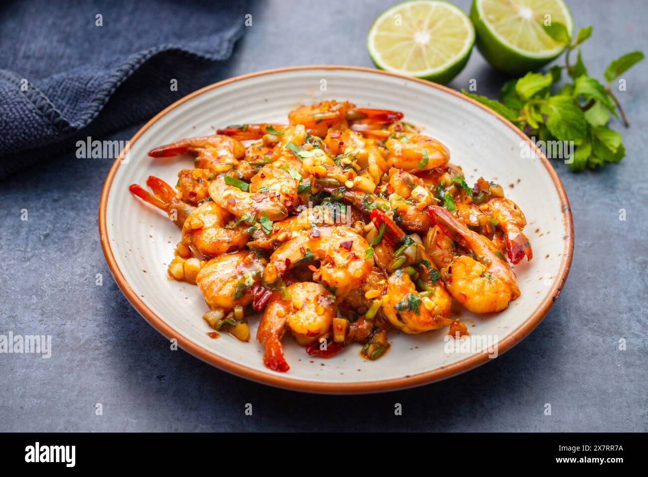 selective focus of Butter Garlic Prawn with a black background Stock ...