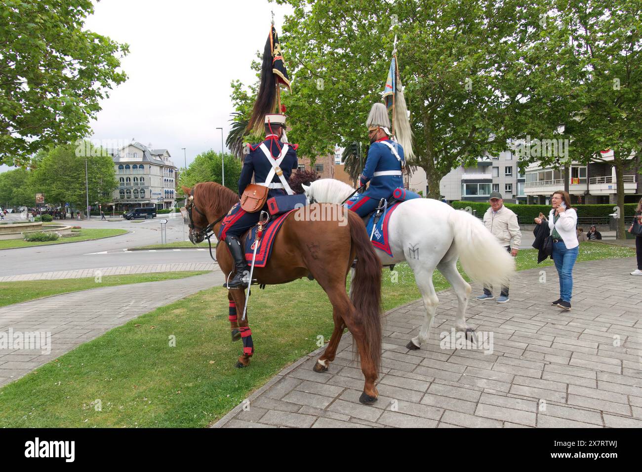 Two soldiers of the Royal Guard in dress uniform on horseback riding ...