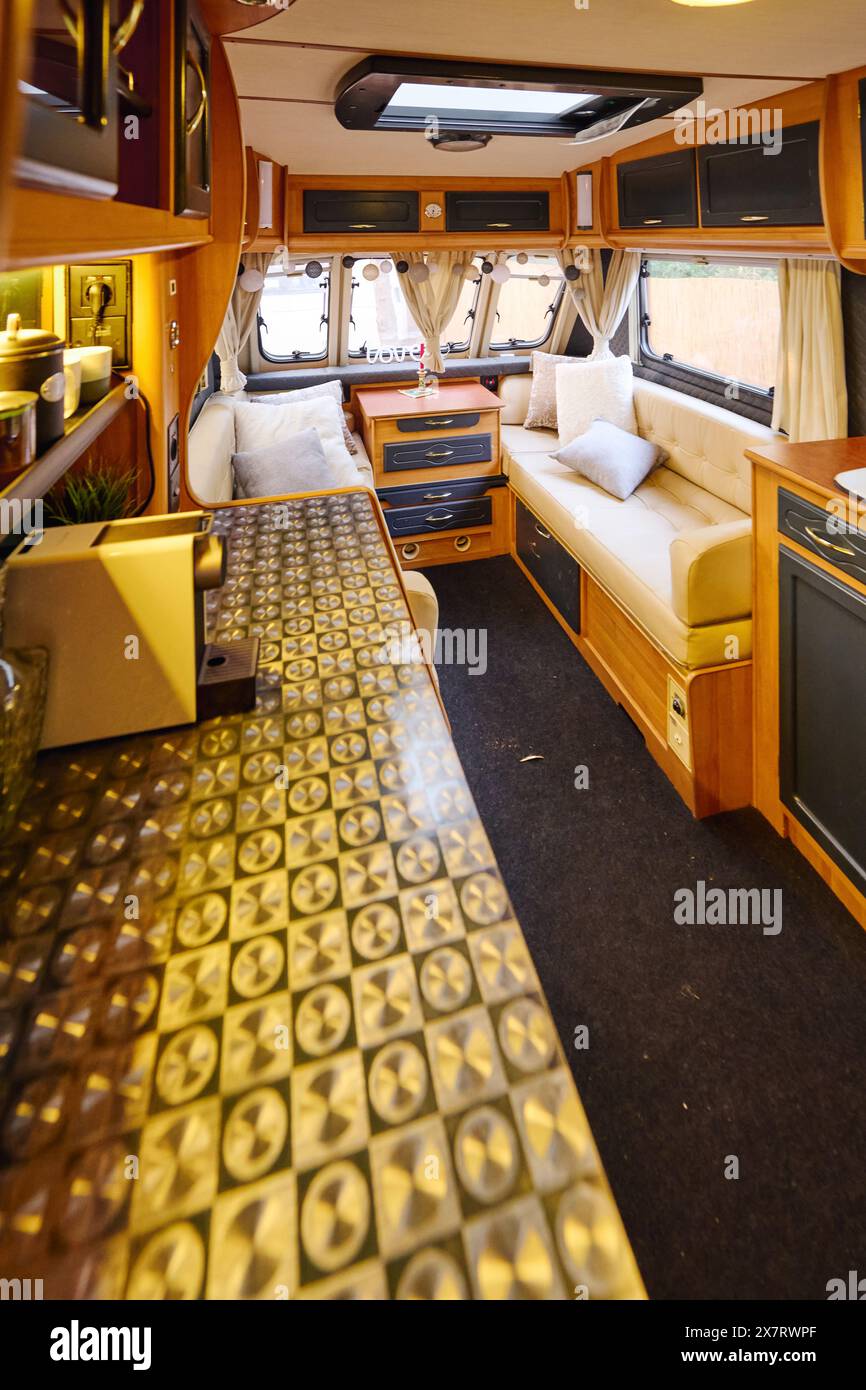 An eclectic mix of furniture fills a bus interior for romantic getaway ...