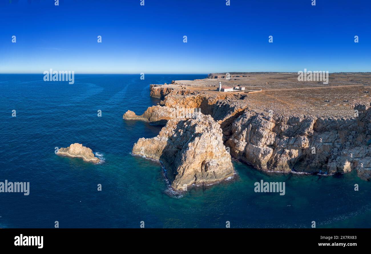 drone view of the Punta Nati lighthouse and coastal cliffs in ...
