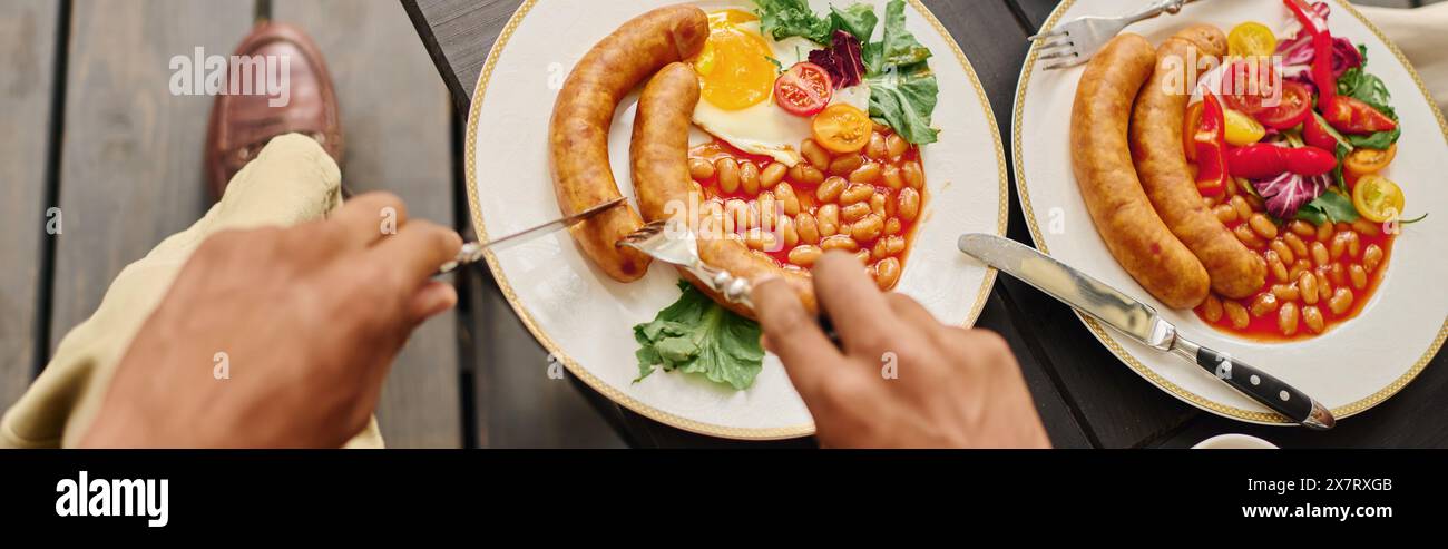 Man Elegantly Cuts Into A Plate Of Delicious Food Using A Knife And