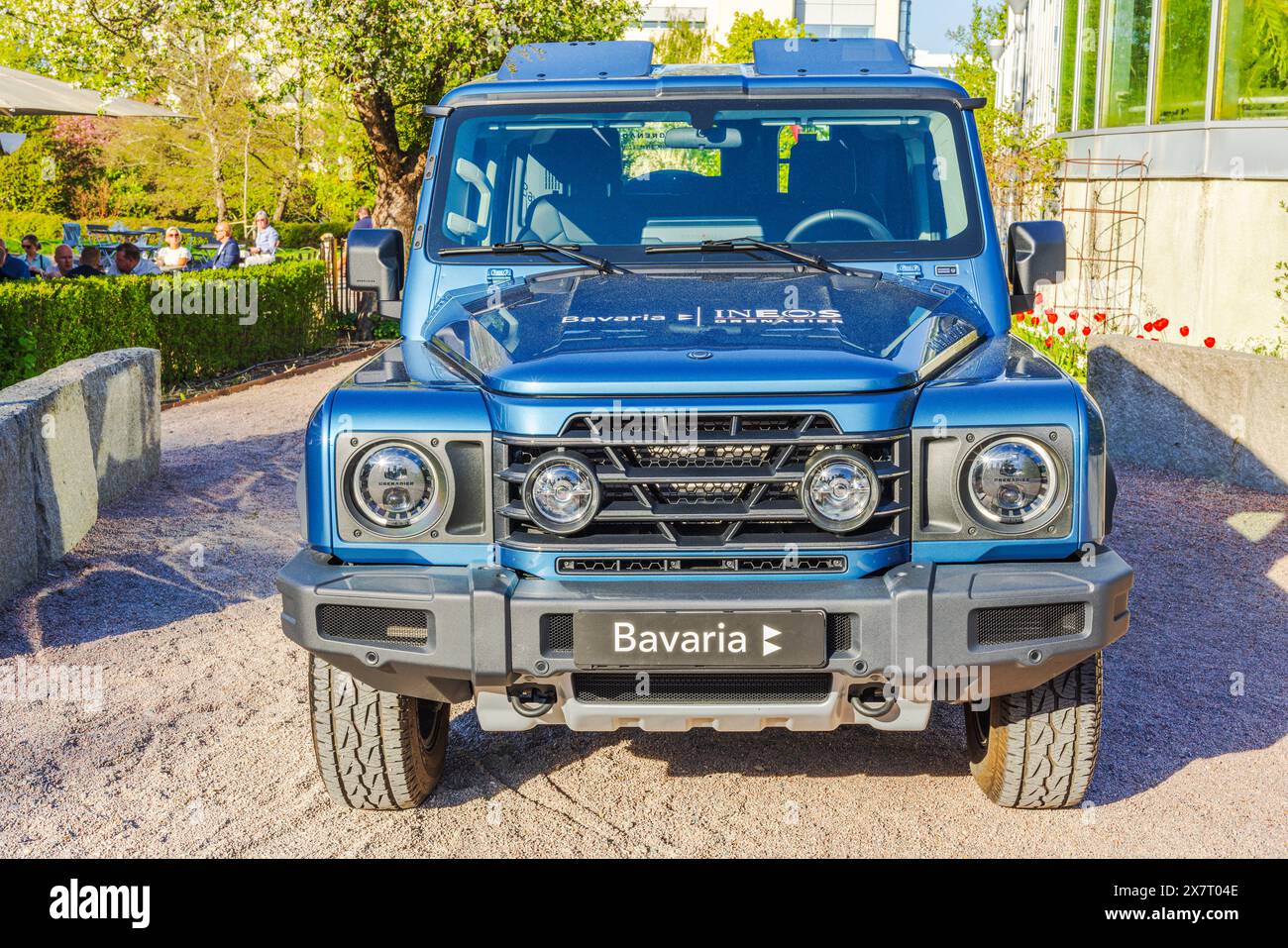 Close-up view of the front of a blue INEOS Grenadier off-road vehicle ...