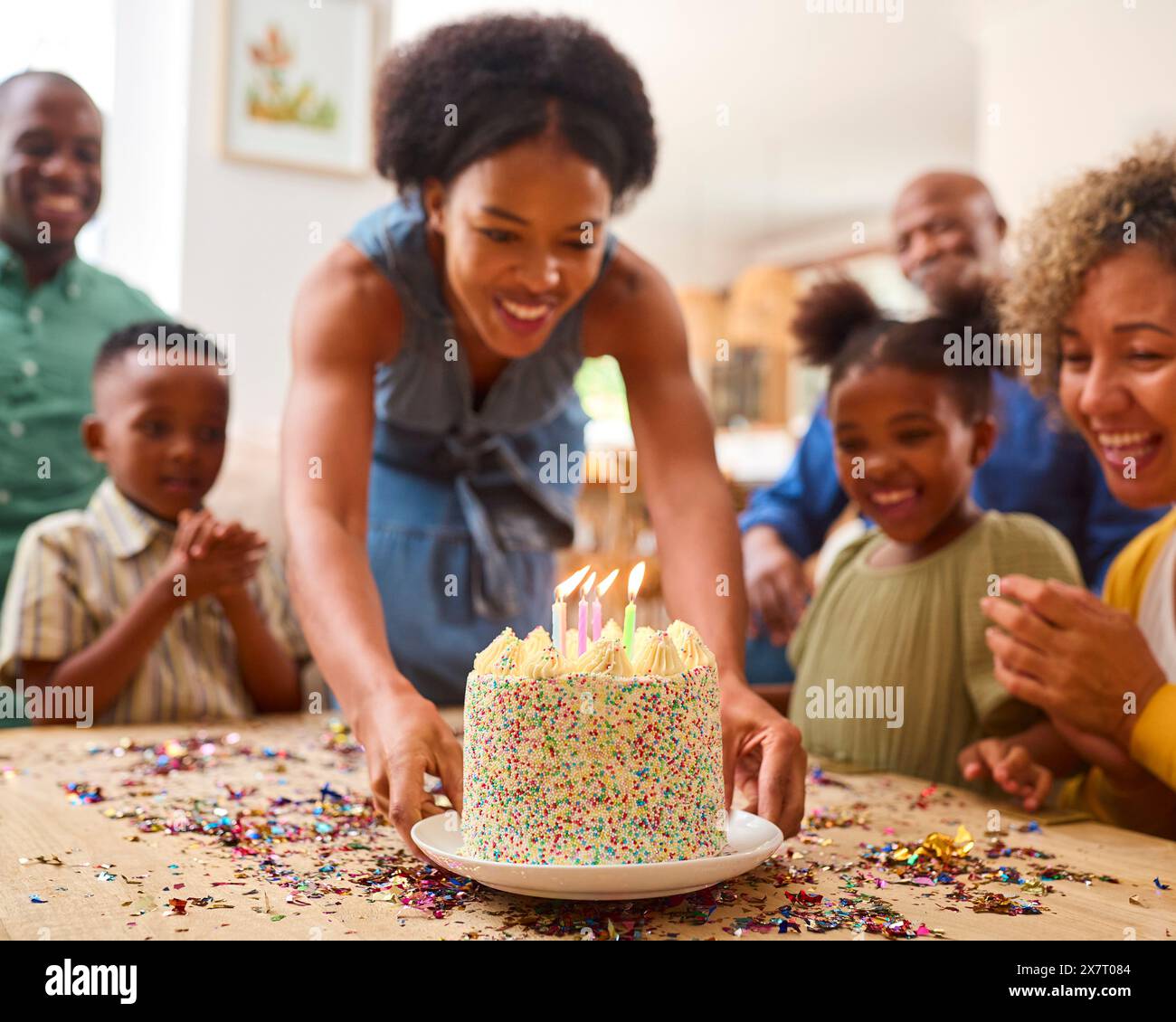 Multi-Generation Family Celebrating Granddaughter's Birthday At Home ...