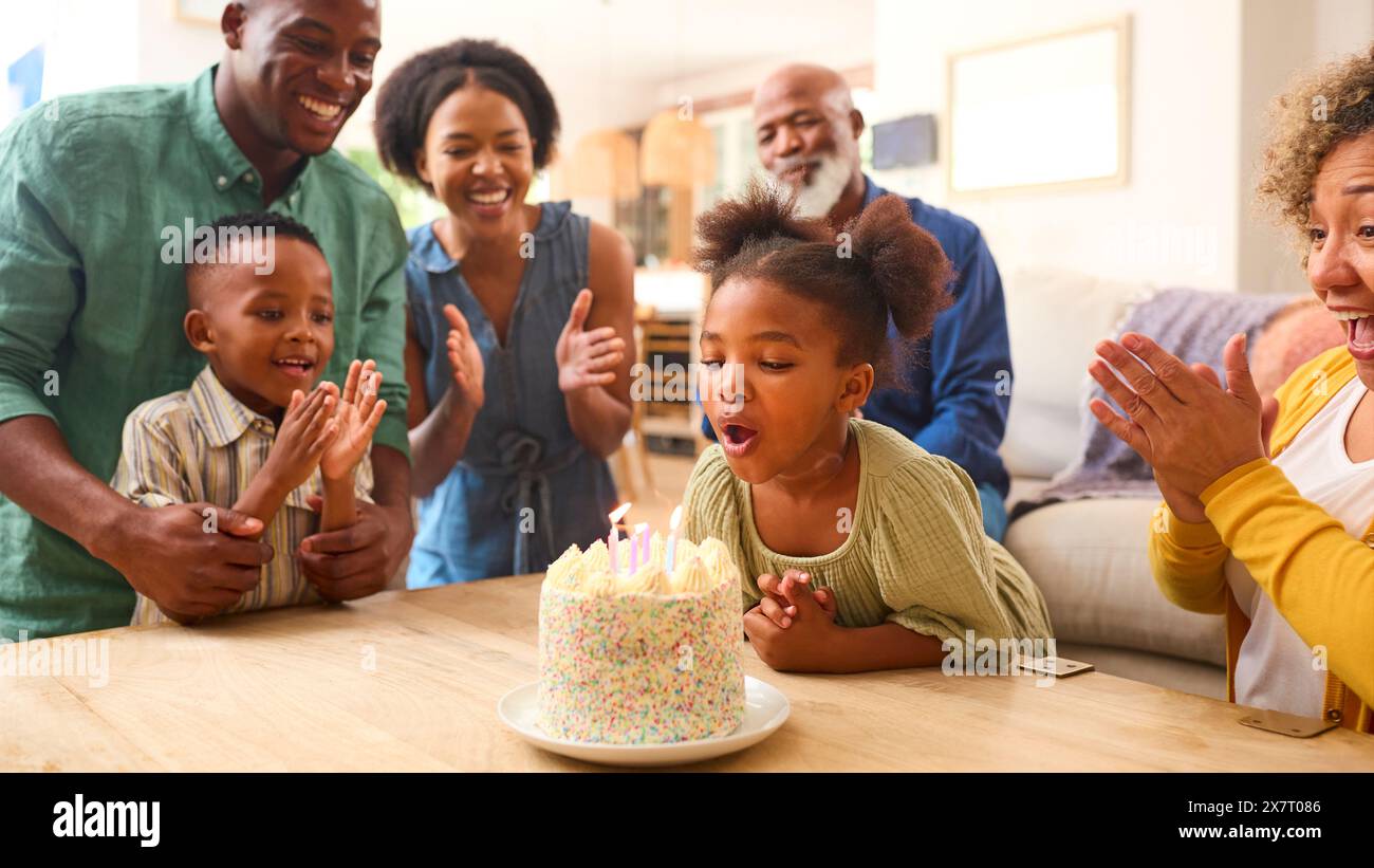 Multi-Generation Family Celebrating Granddaughter's Birthday At Home ...
