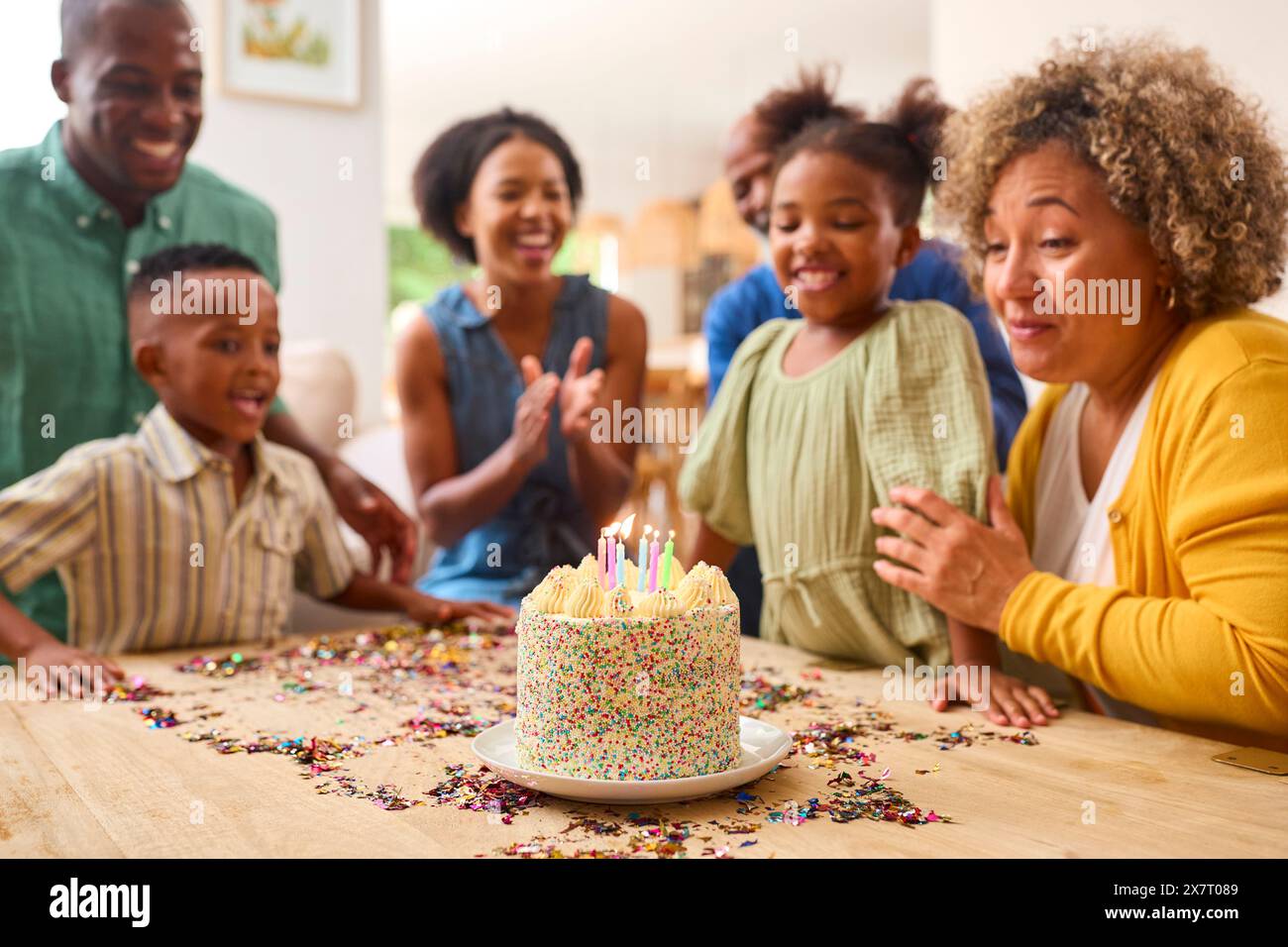 Multi-Generation Family Celebrating Granddaughter's Birthday At Home ...