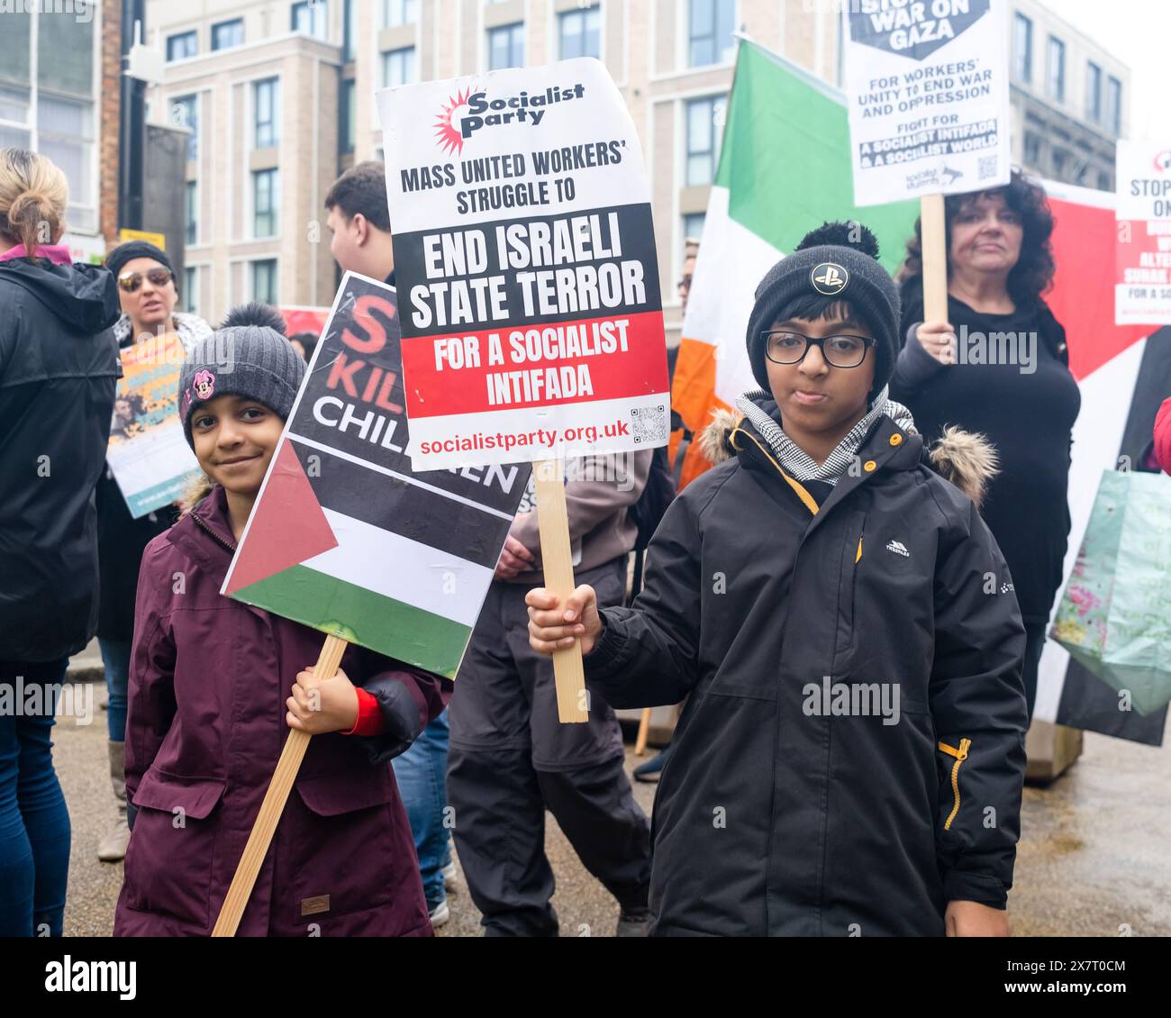Two children are holding protest signs with political messages calling ...