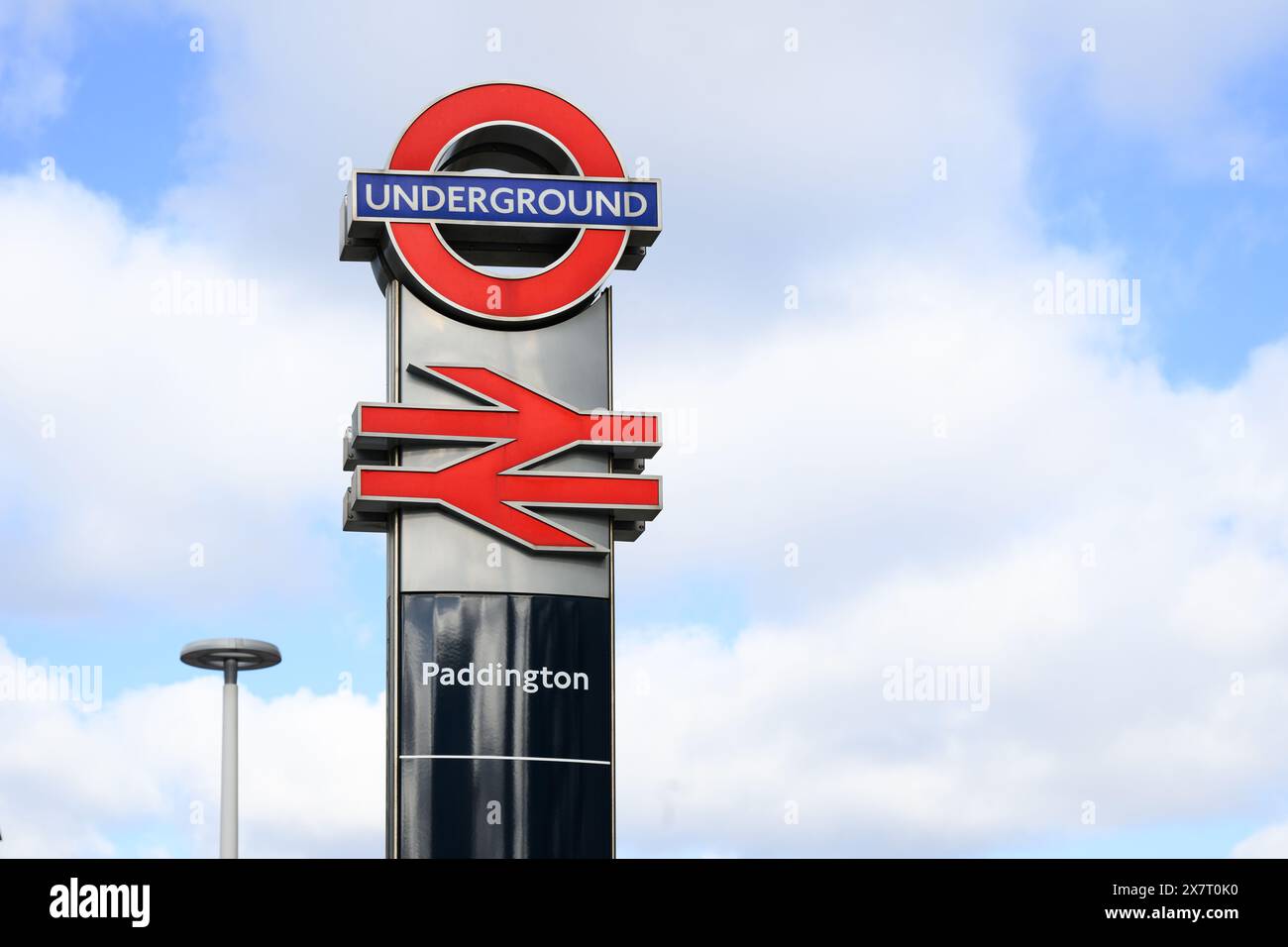 London, UK - March 23, 2024; Roundel and double arrow train signs at ...