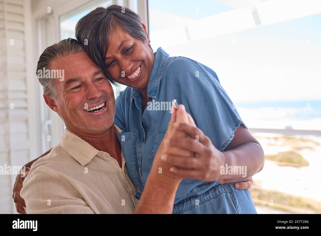 Mature Couple With Man Proposing Marriage Kneeling And Giving Woman