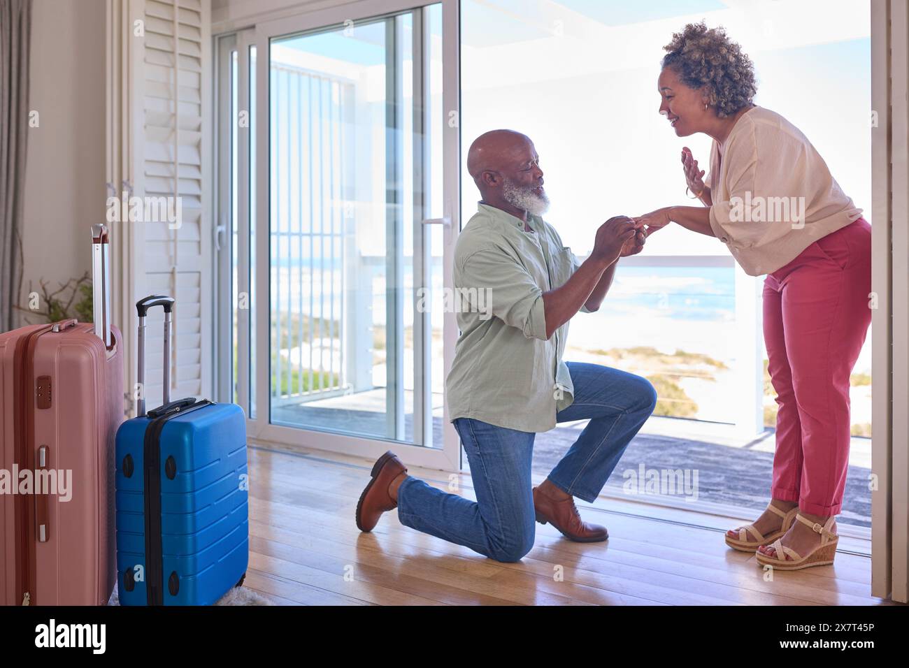 Mature Couple With Man Proposing Marriage Kneeling And Giving Woman