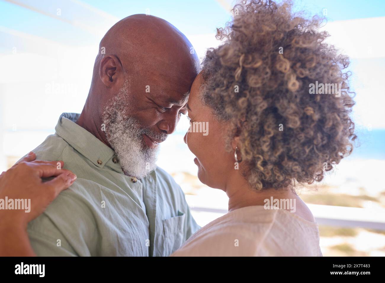 Close Up Of Loving Mature Couple Hugging In Beachfront House ...