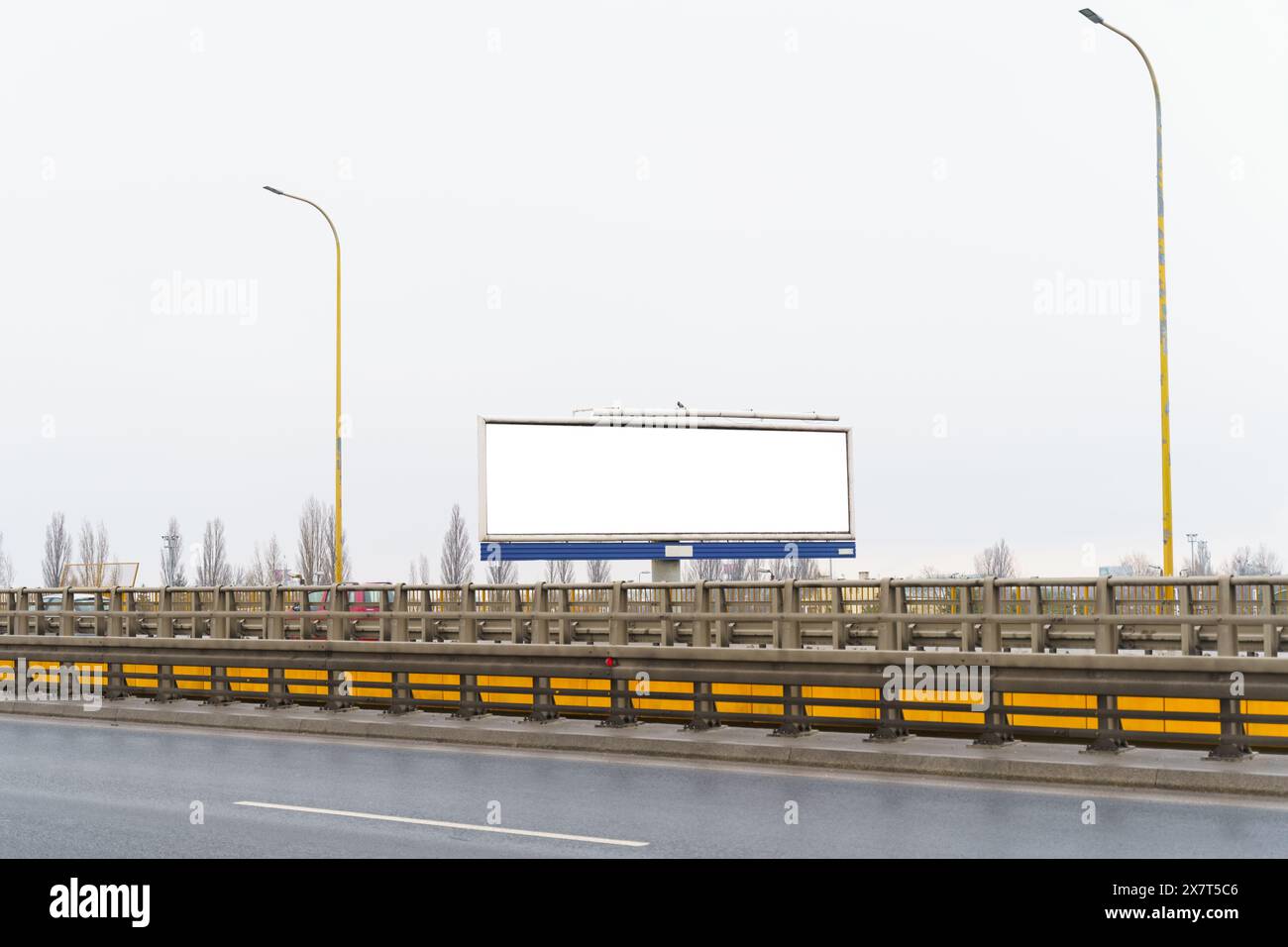 A massive billboard with a white background is prominently placed on ...