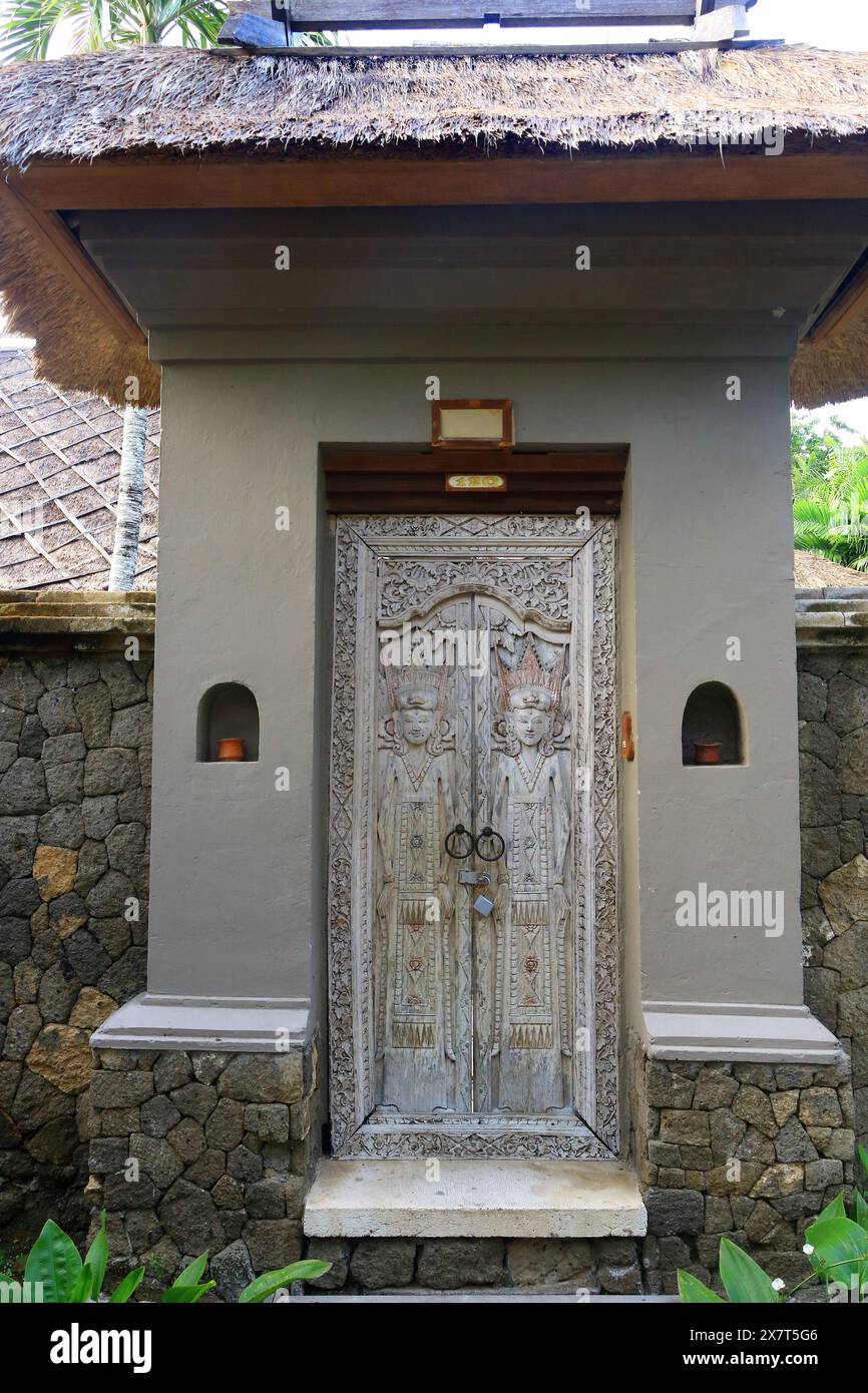 a Traditional balinese handmade carved wooden door. Bali style ...