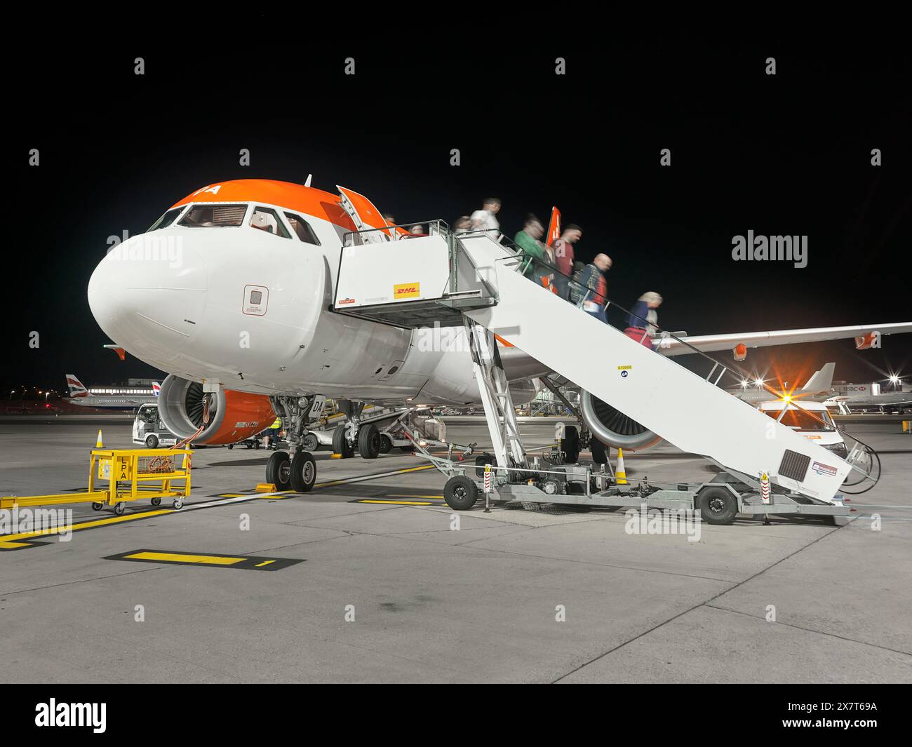 Passengers descend from an Easyjet plane on the tarmac at Gatwick ...