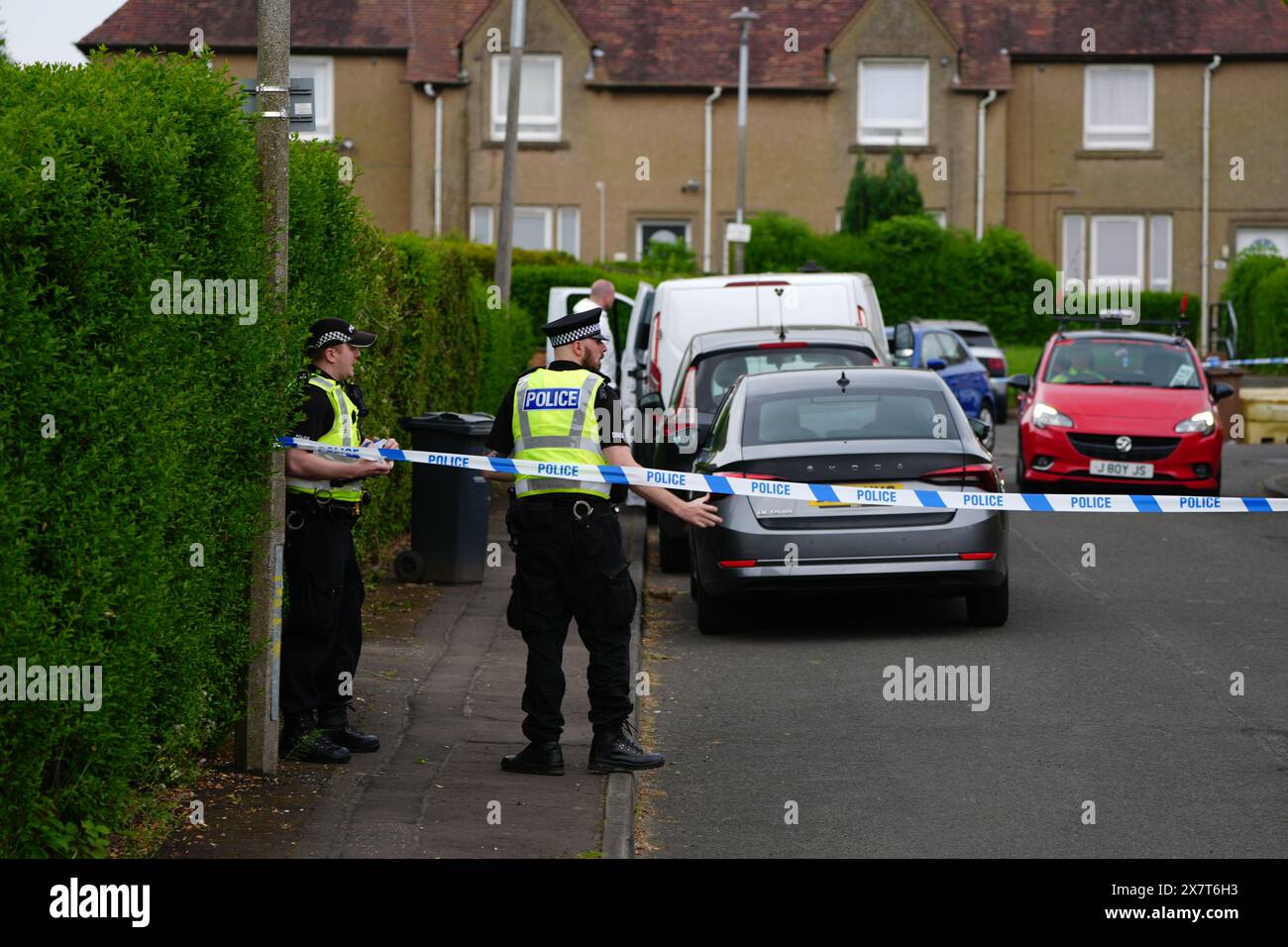 The scene in Fernieside Crescent, Edinburgh, following the death of a 78-year-old woman. A man ...