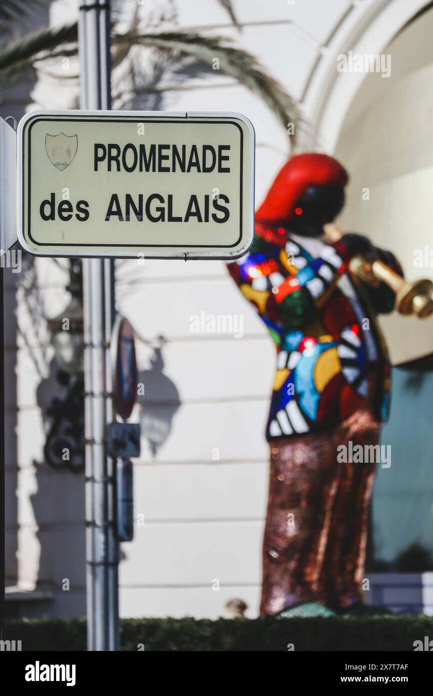 Sign on the Promenade des Anglais in Nice with the Hotel Negresco in ...