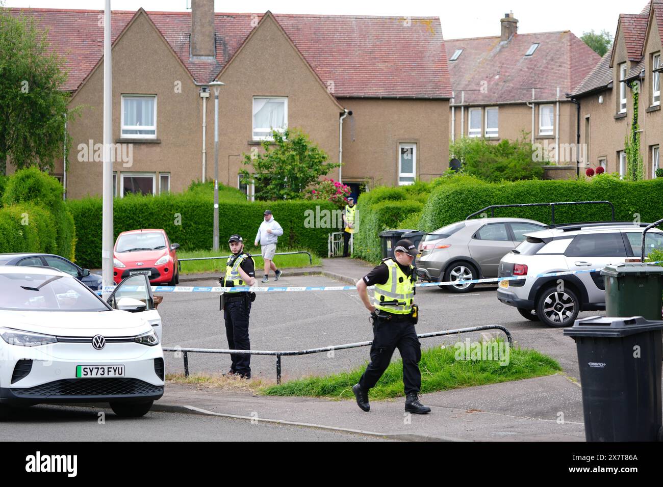 The scene in Fernieside Crescent, Edinburgh, following the death of a 78-year-old woman. A man ...