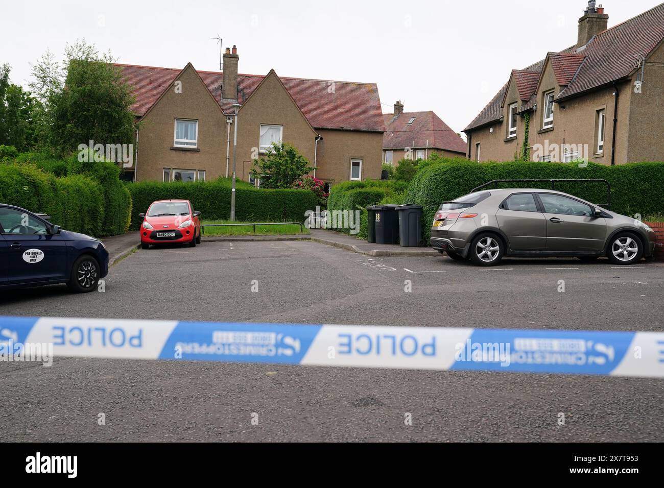 The scene in Fernieside Crescent, Edinburgh, following the death of a 78-year-old woman. A man ...
