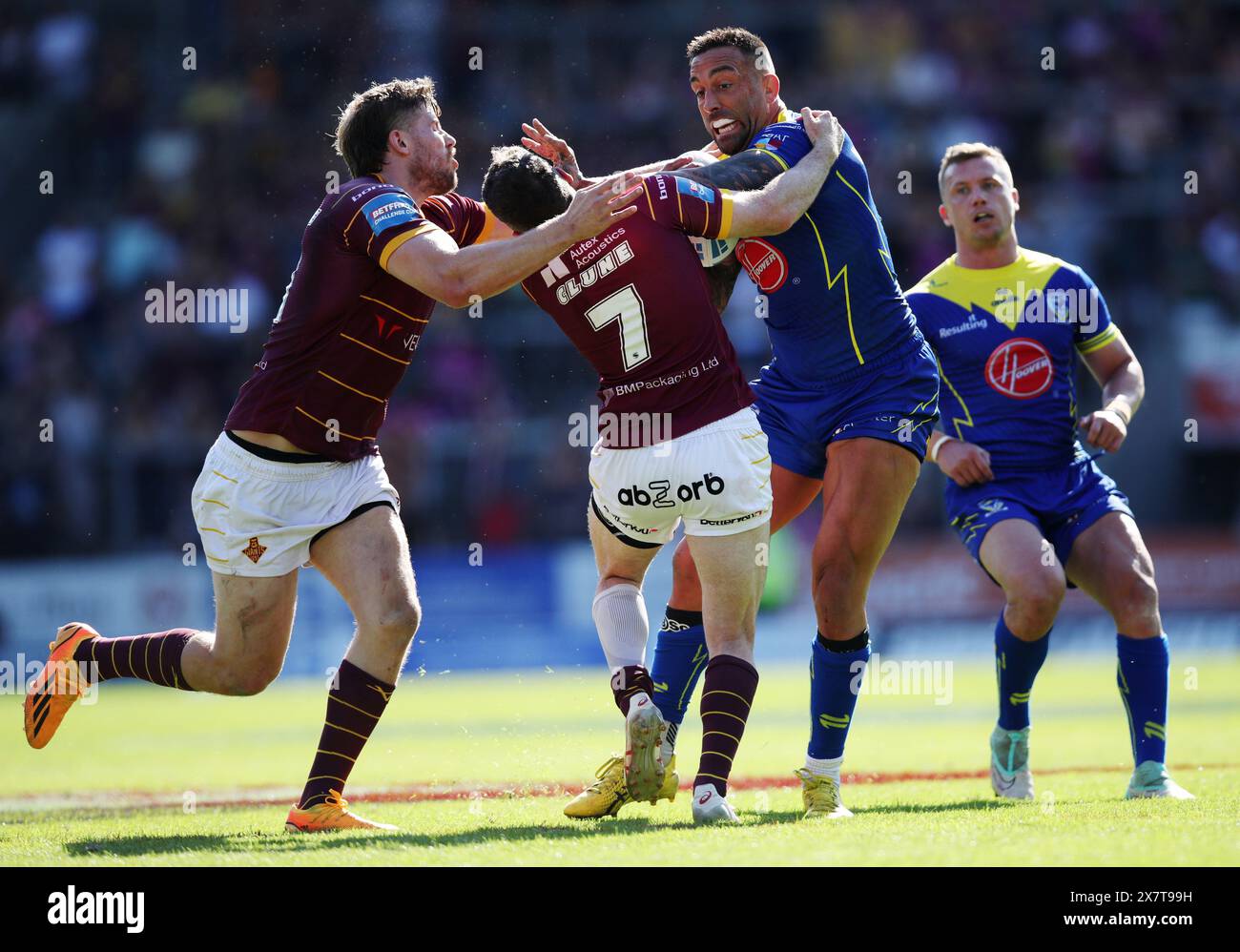 Warrington Wolves' Paul Vaughan is challenged by Huddersfield Giants ...