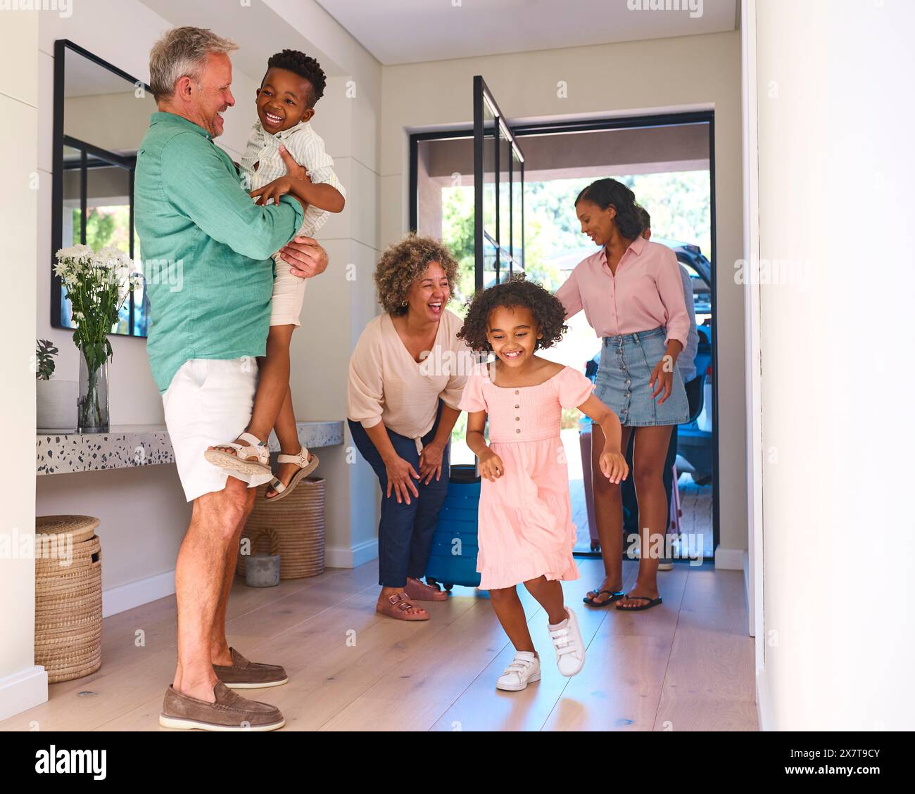 Son and daughter visiting grandmother hi-res stock photography and ...