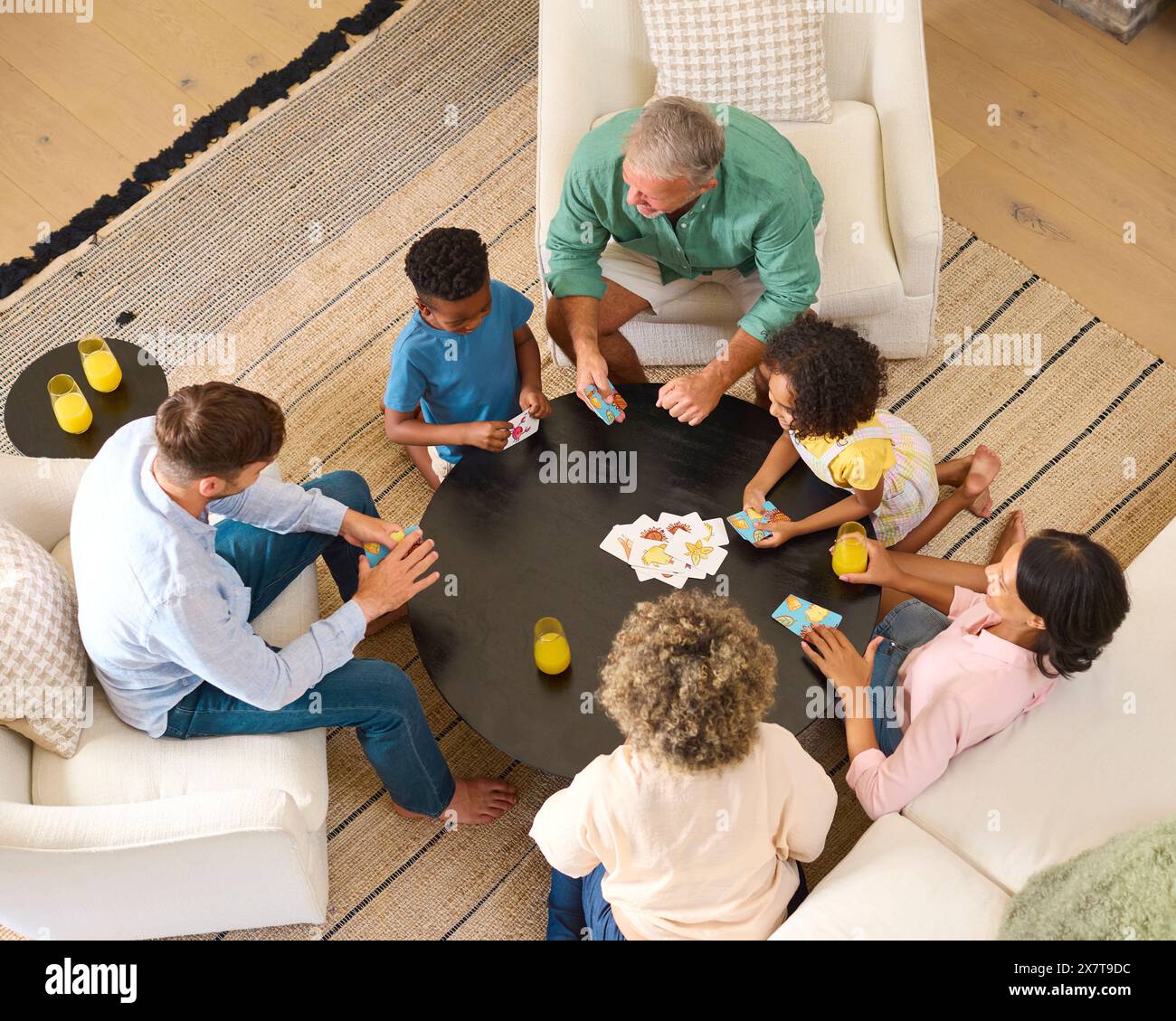 Overhead Shot Of Three Generation Family Laughing Sitting On Sofa ...