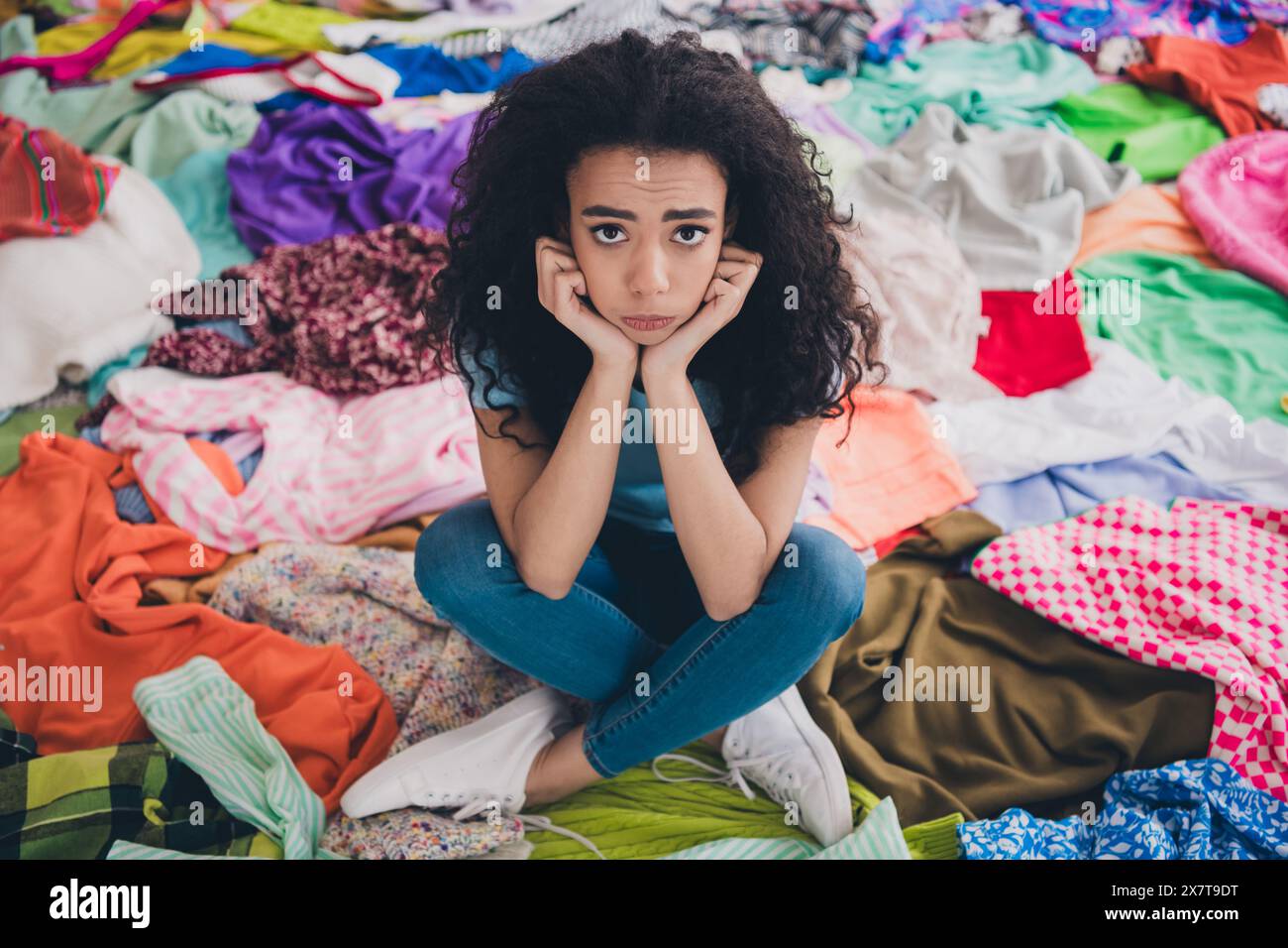 High angle view full size photo of moody young girl sitting pile stack ...