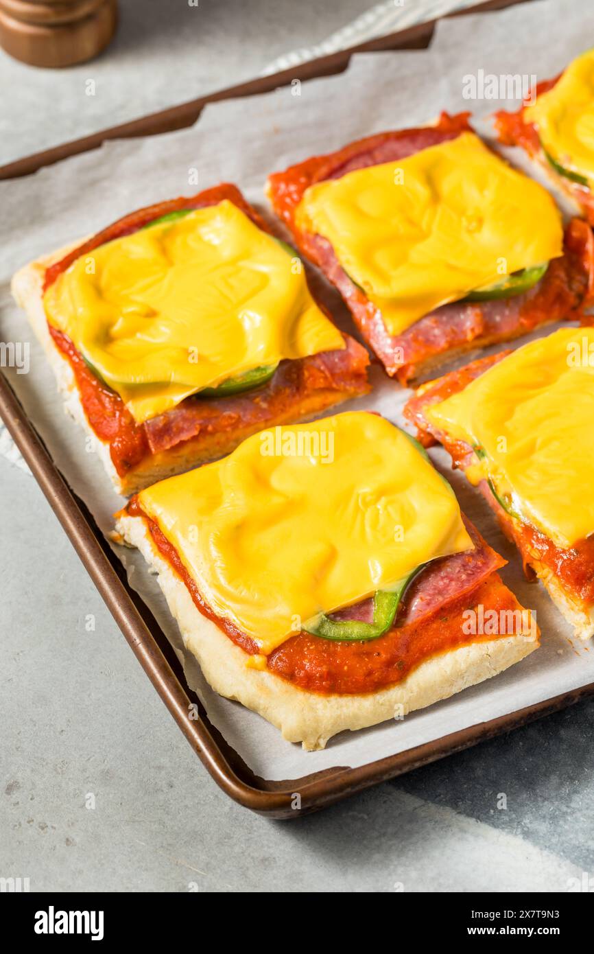 Italian Homemade Altoona Style Pizza Slices with Salami and American Cheese Stock Photo - Alamy