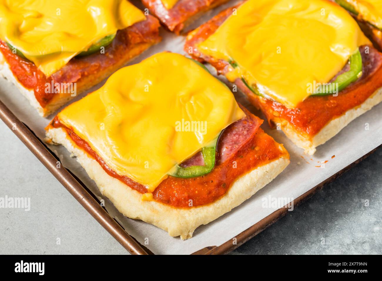 Italian Homemade Altoona Style Pizza Slices with Salami and American Cheese Stock Photo - Alamy