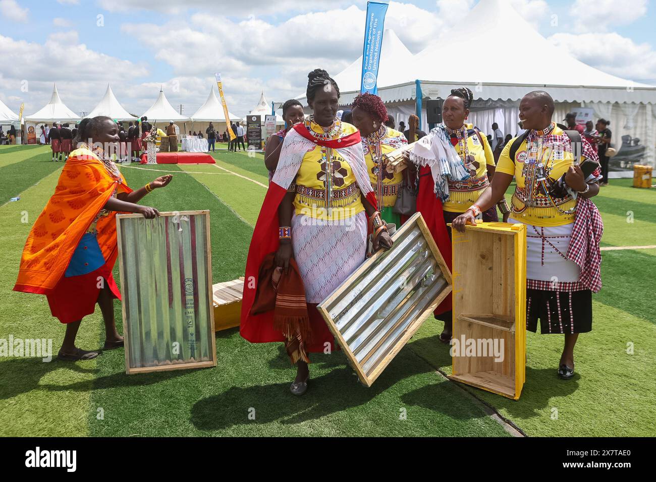 Local bee farmers full of joy after receiving a donation of hives and ...