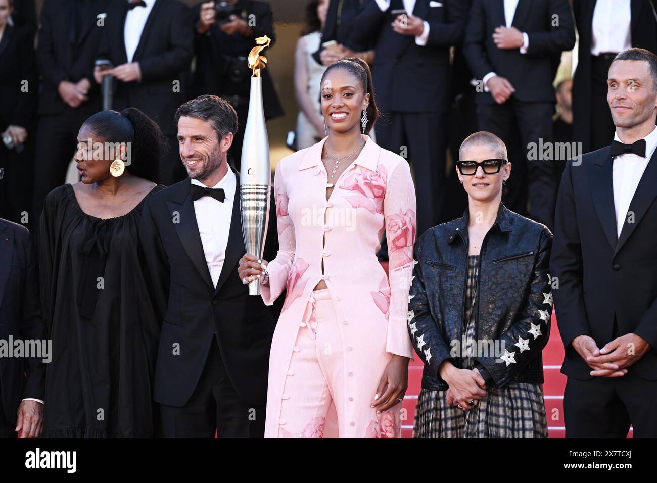 (left-right) Marie-Jose Perec, Tony Estanguet, Iliana Rupert, holding ...