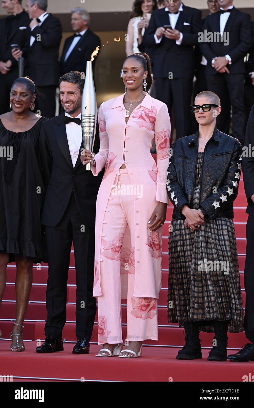 (left-right) Marie-Jose Perec, Tony Estanguet, Iliana Rupert, holding ...