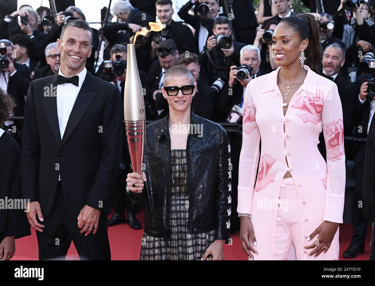 (left-right) Alexis Hanquinquant, Marie Patouillet, holding the Olympic ...
