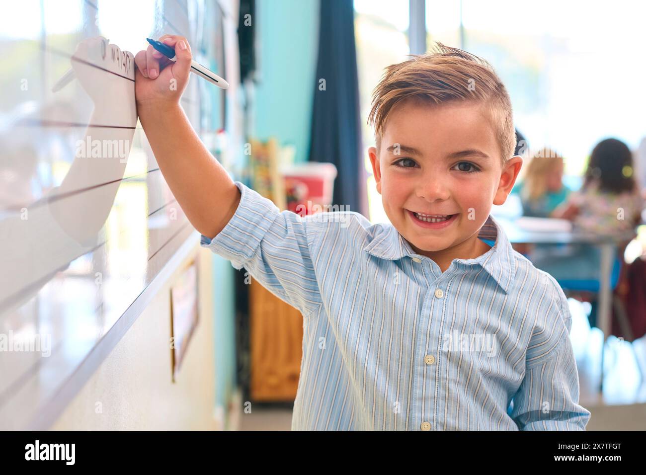 Portrait Of Male Primary Or Elementary School Student Writing On ...
