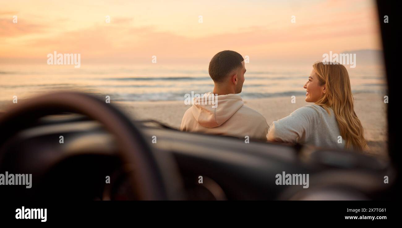 Rear View Of Couple Chatting By Car At Beach Watching Sunrise Together ...