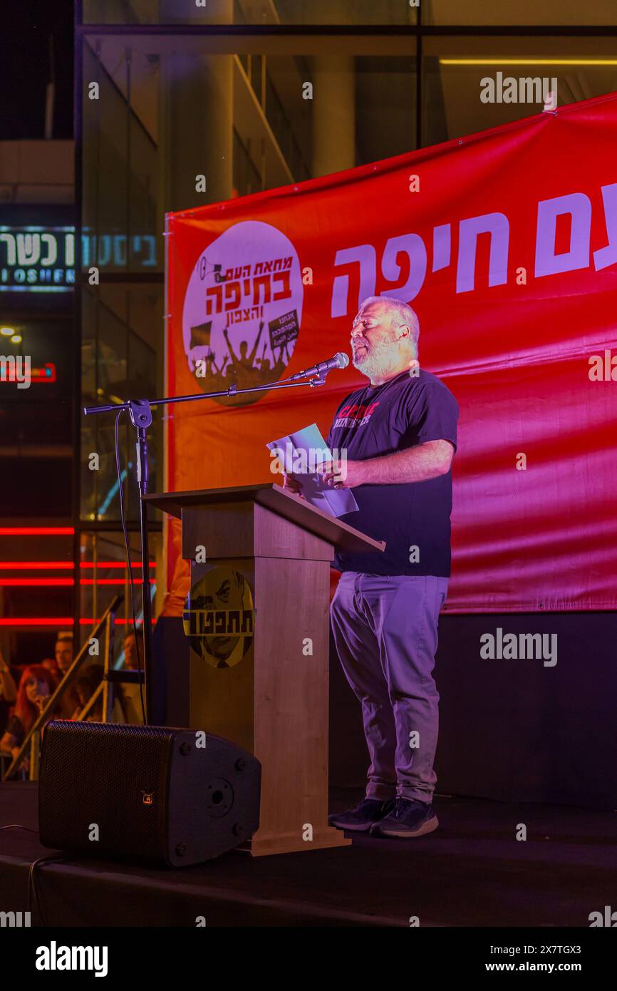 Haifa, Israel - May 18, 2024: Protest leader Gonen Ben Itzhak speaks to ...