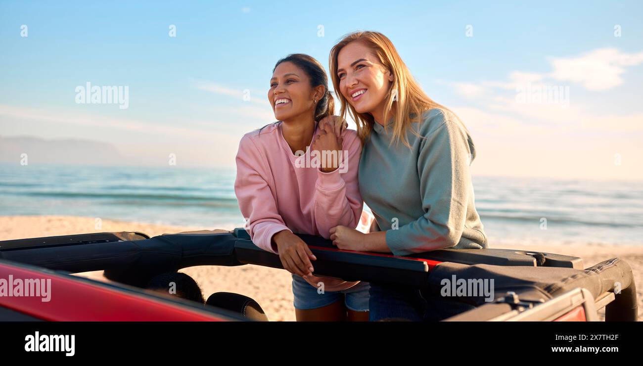 Two Women On Vacation In Car Driving On Road Trip Adventure To Beach ...