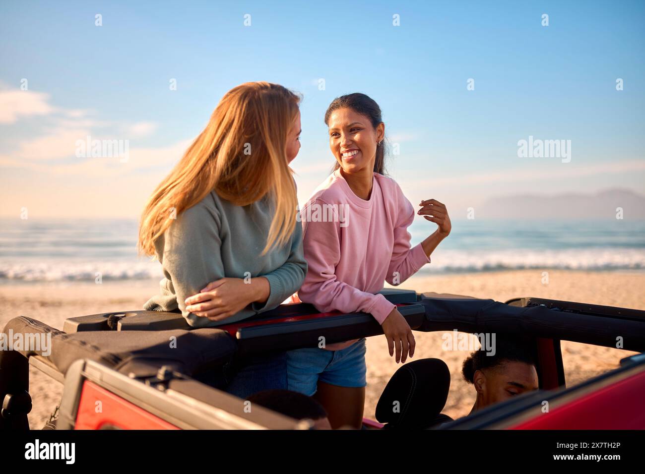 Two Women On Vacation In Car Driving On Road Trip Adventure To Beach ...