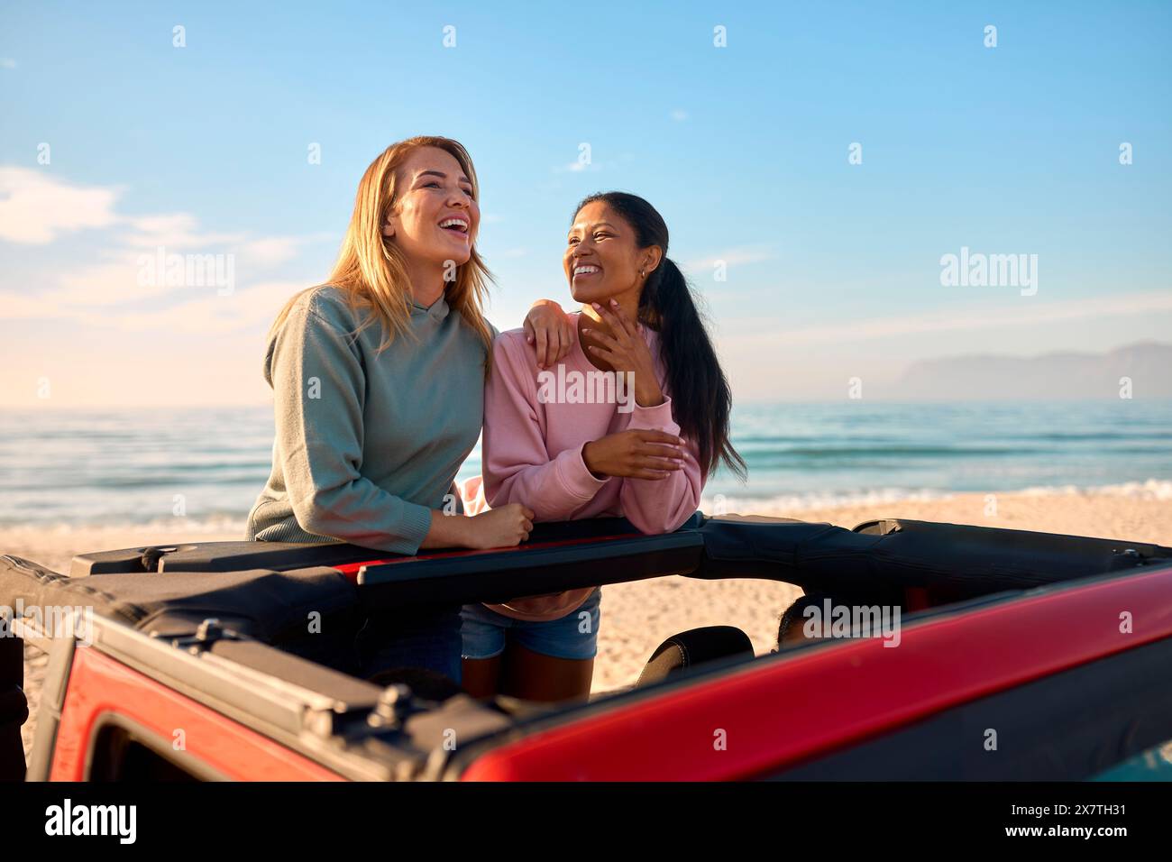 Two Women On Vacation In Car Driving On Road Trip Adventure To Beach ...