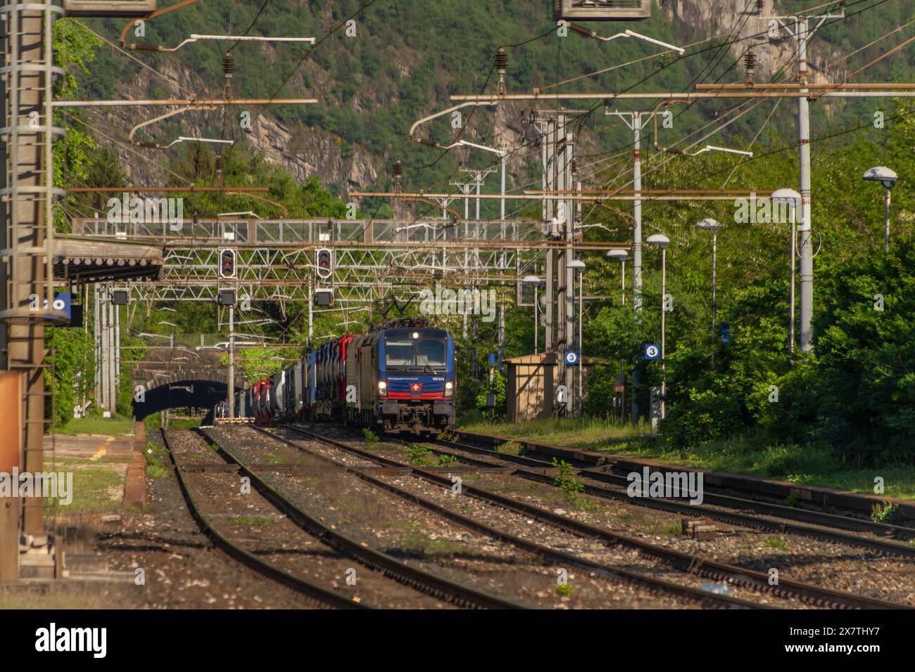 Trains in evening spring railway station in Varzo Italy 05 11 2024 ...