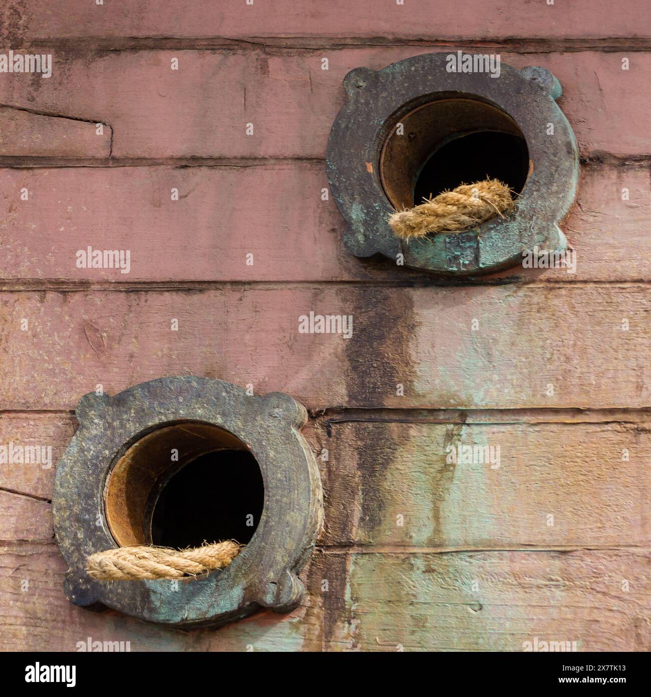 two boat anchor rope holes on an old wooden boat Stock Photo - Alamy