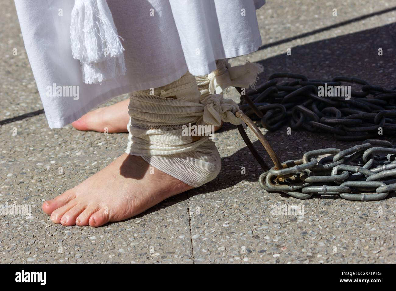 LUQA, MALTA - 17th March 2024. A foot with chains at the Good Friday ...