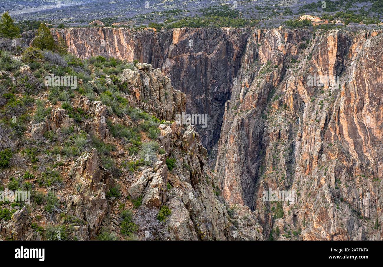 May 21, 2024: Rich greens and reds color the steep canyon walls of the ...
