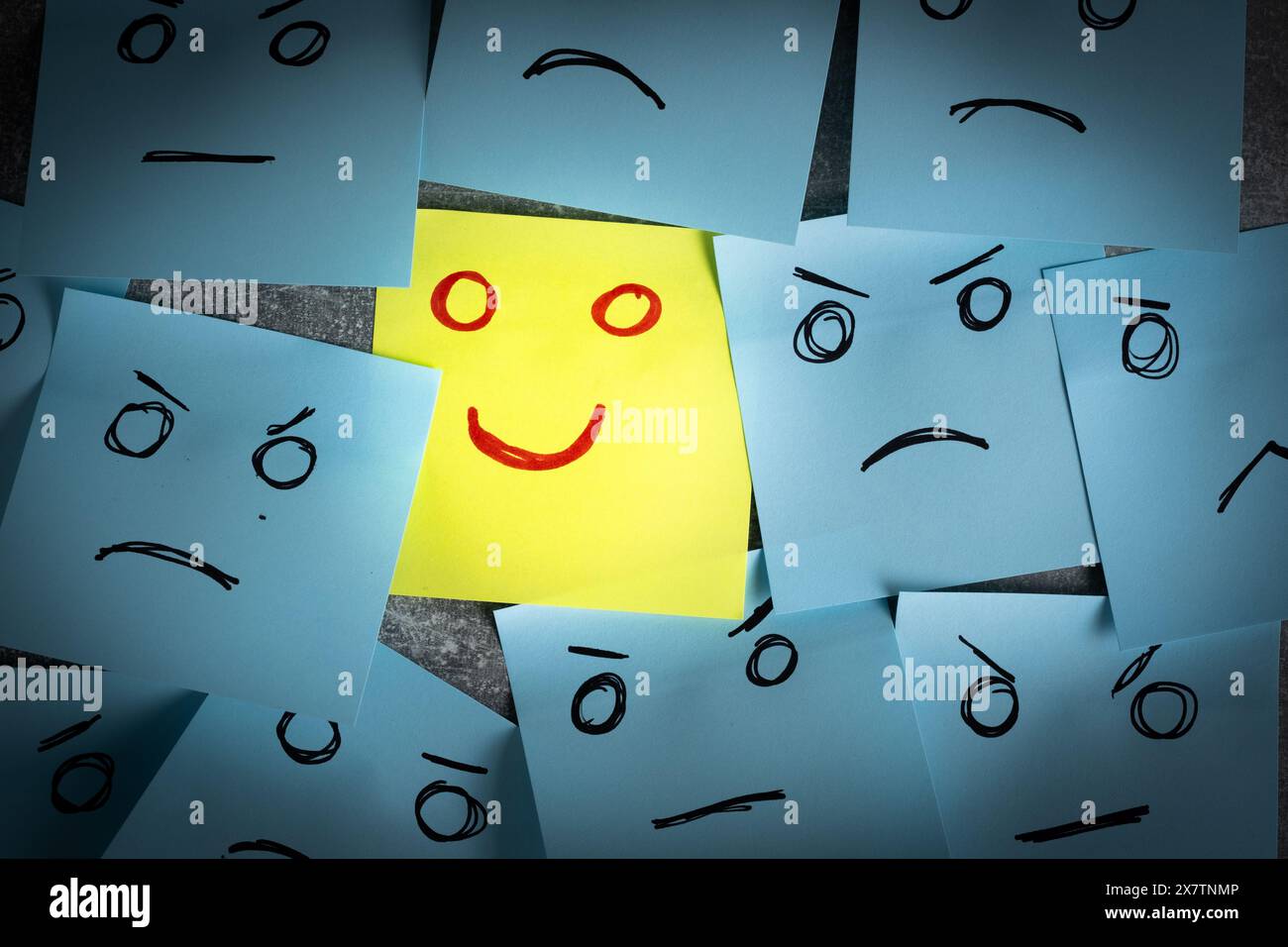 Concept positive attitude. Pieces of paper for notes with sad and angry ...