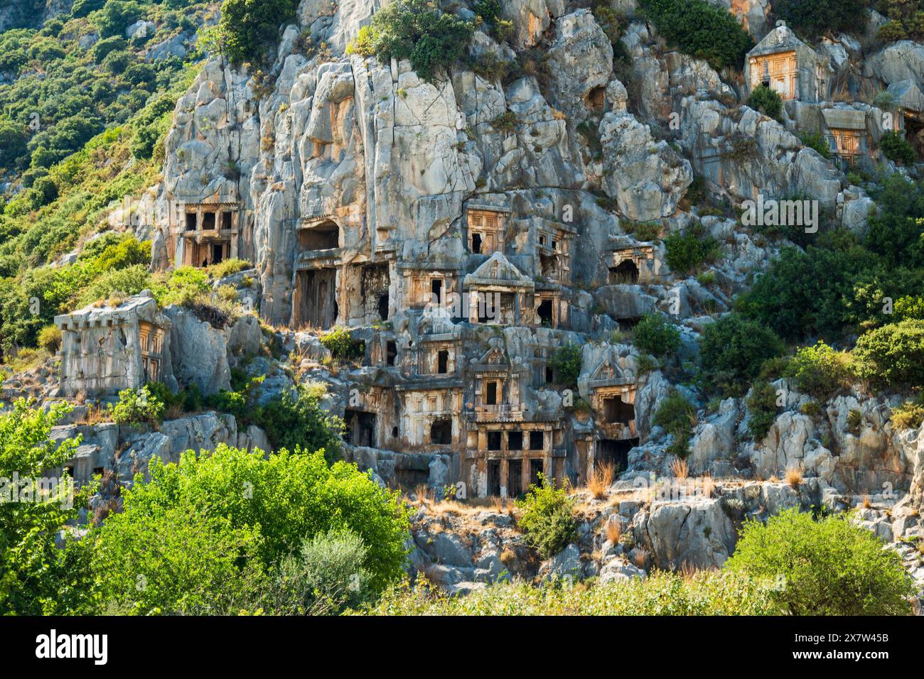 Myra archaeological site with rock tombs in Demre, Turkey. The Ancient ...