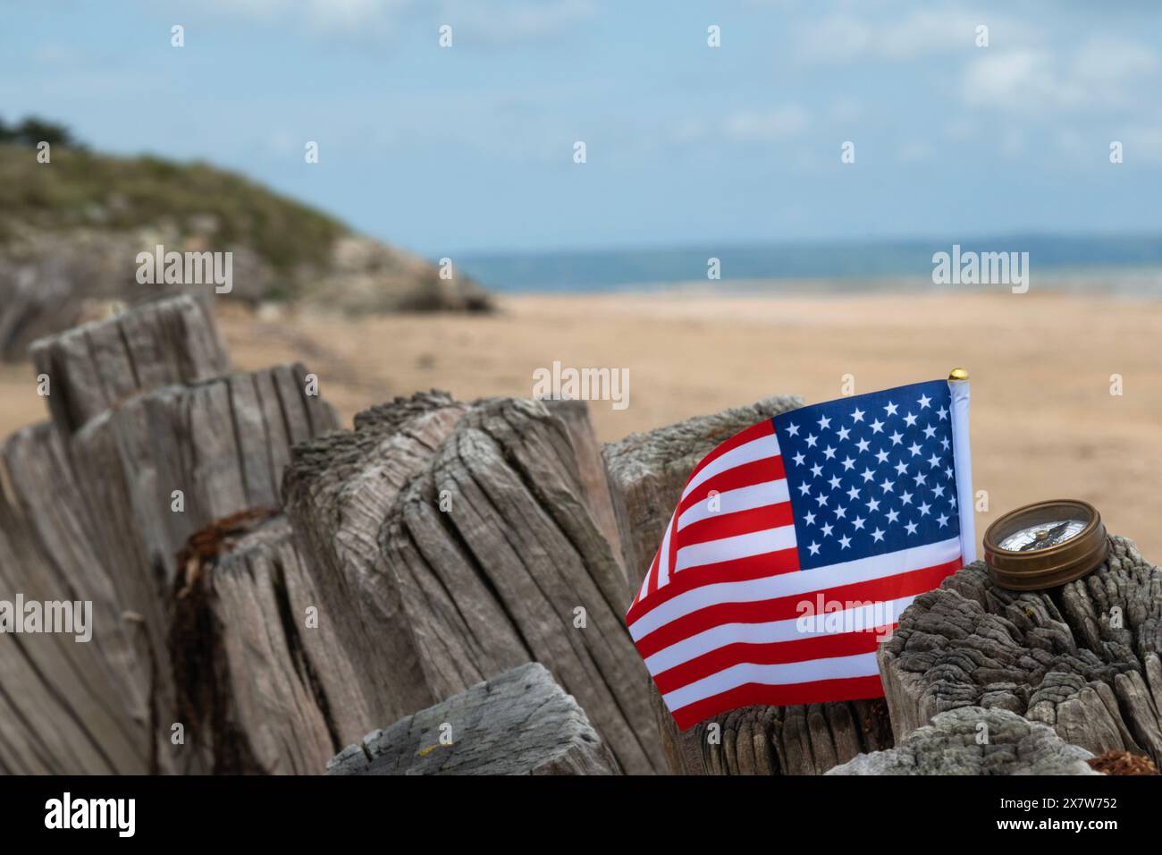 Utah Beach Normandy with USA flag selective focus on beach and ocean ...