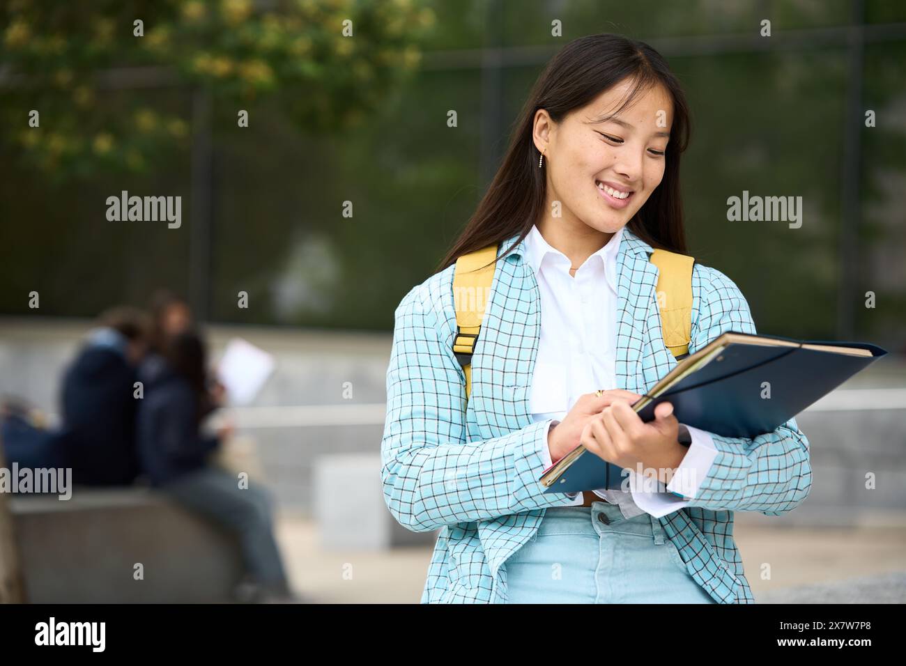 Chinese student at campus university wearing a blue jacket Stock Photo ...